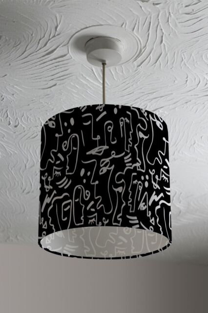 faces masks and geometric shapes repeating ceiling lamp shade by ...