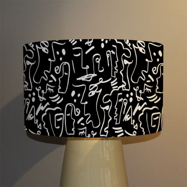 faces masks and geometric shapes repeating ceiling lamp shade by ...