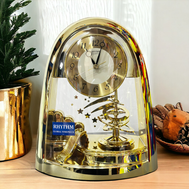 Rhythm Mantel Clock Gold With Rotating Pendulum And Shooting Stars by ...